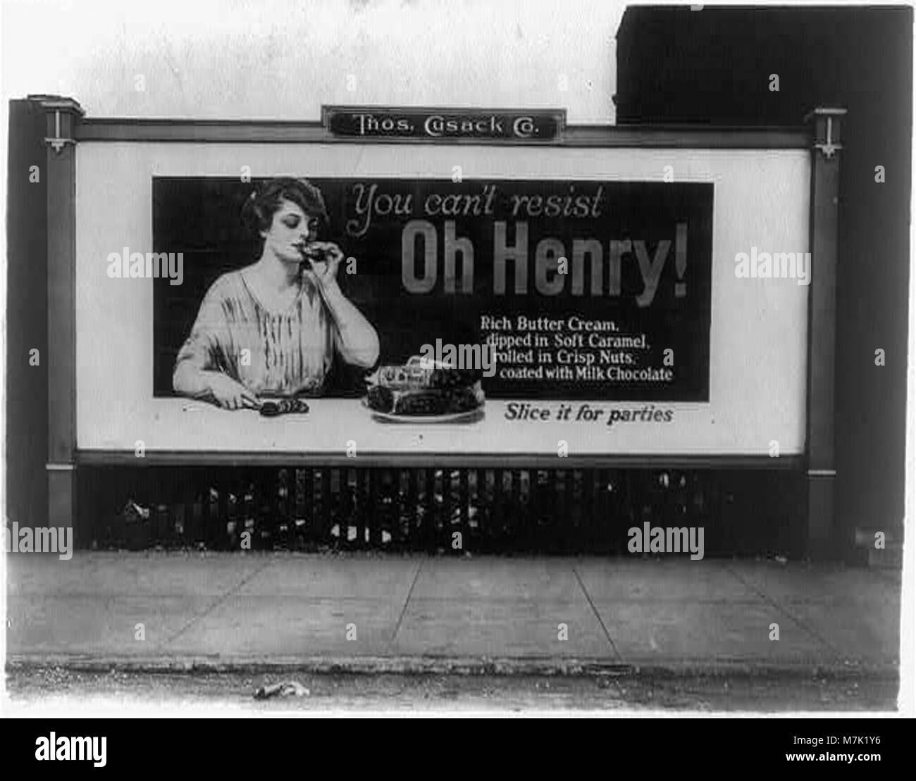 A billboard advertisement featuring a woman eating an Oh Henry candy ...