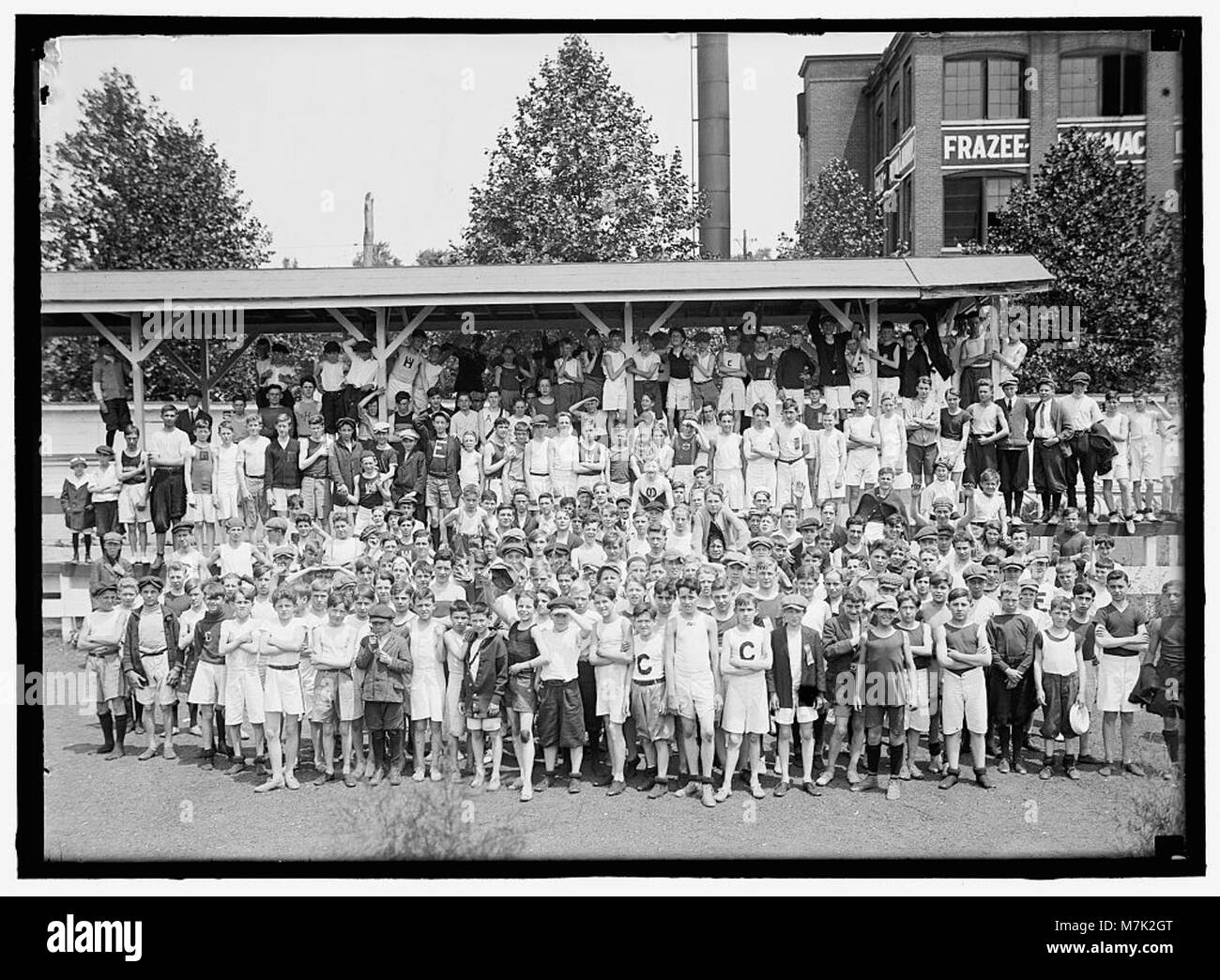 A photograph of Boy Scouts engaged in field sports, demonstrating ...