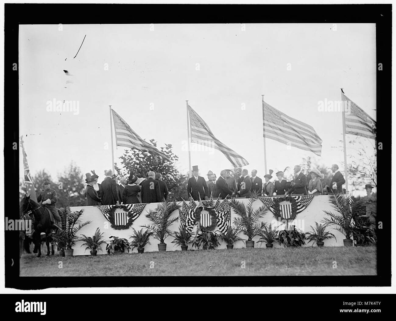 President Woodrow Wilson attends a cavalry review, observed by General ...