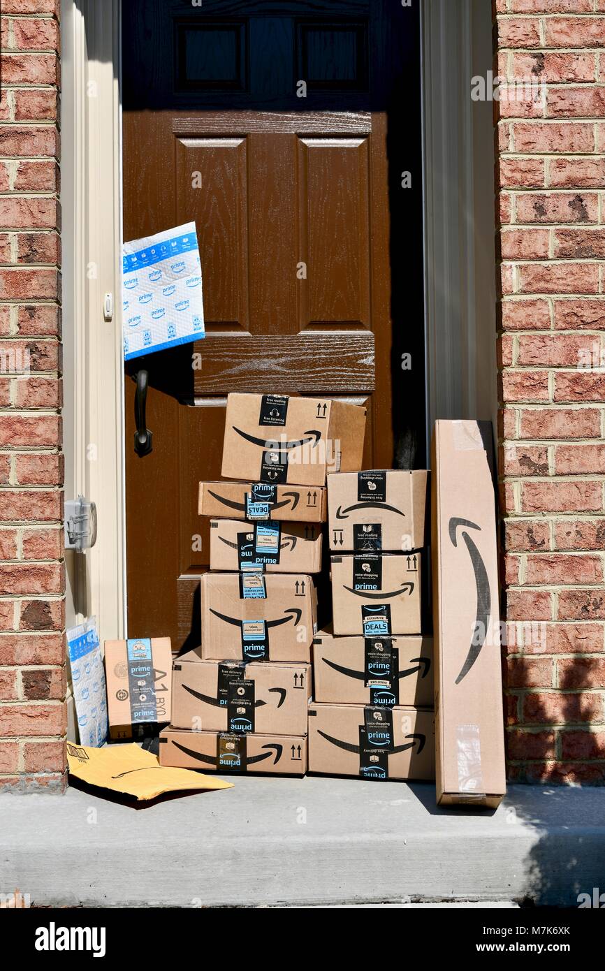 Amazon Prime boxes delivered and stacked at the front door of a ...