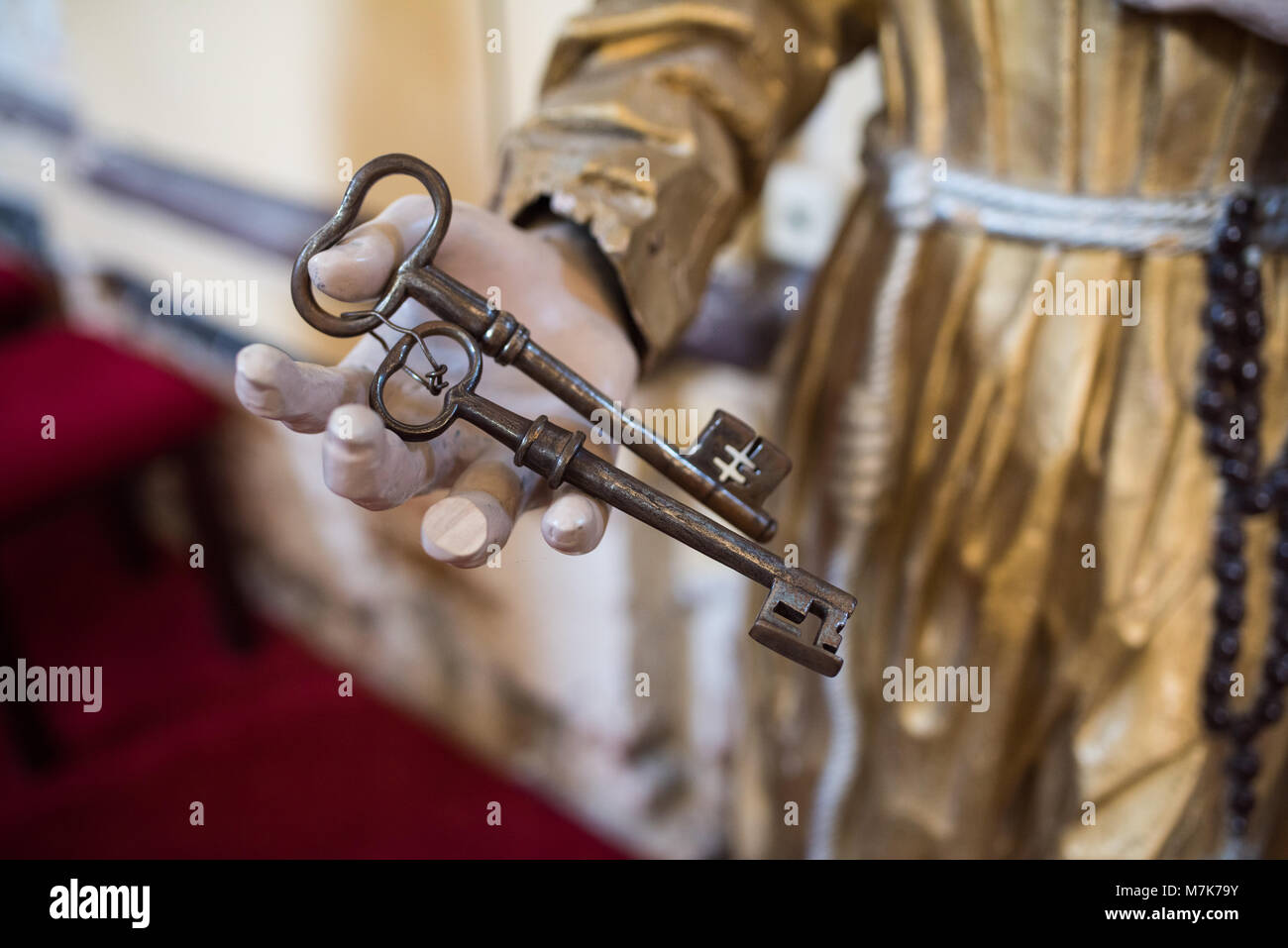 Old ancient bronze keys in monk hand Stock Photo - Alamy
