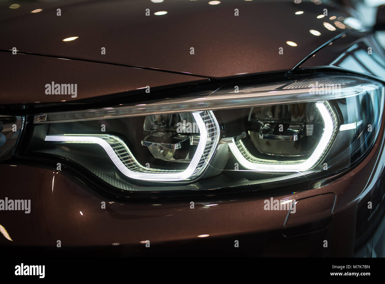 Headlights of modern and futuristic sport car Stock Photo - Alamy