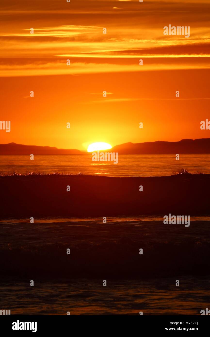 Sun setting over surf hi-res stock photography and images - Alamy
