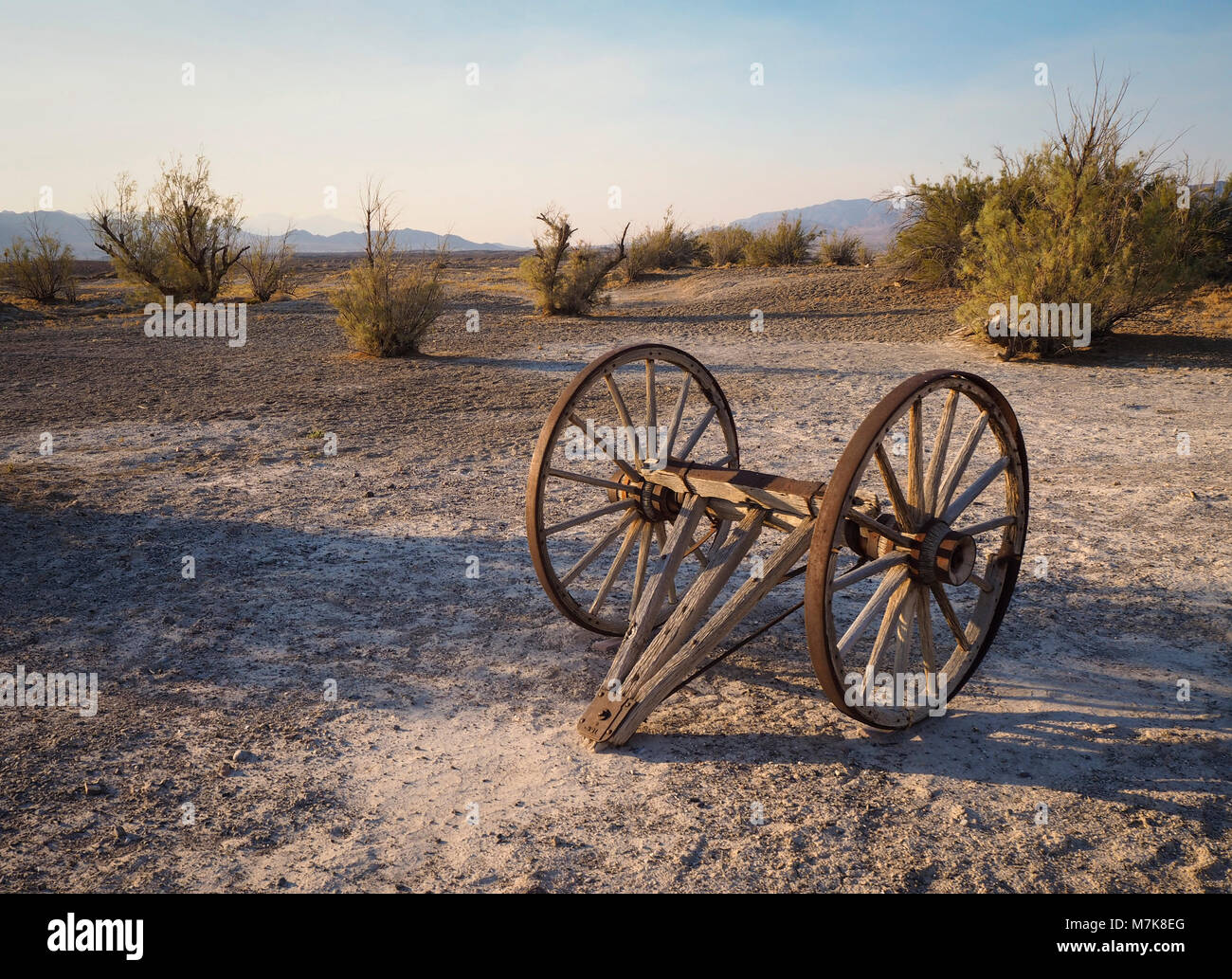 Abandoned wooden wagon and cartwheels in the desert near Tecopa Hot ...