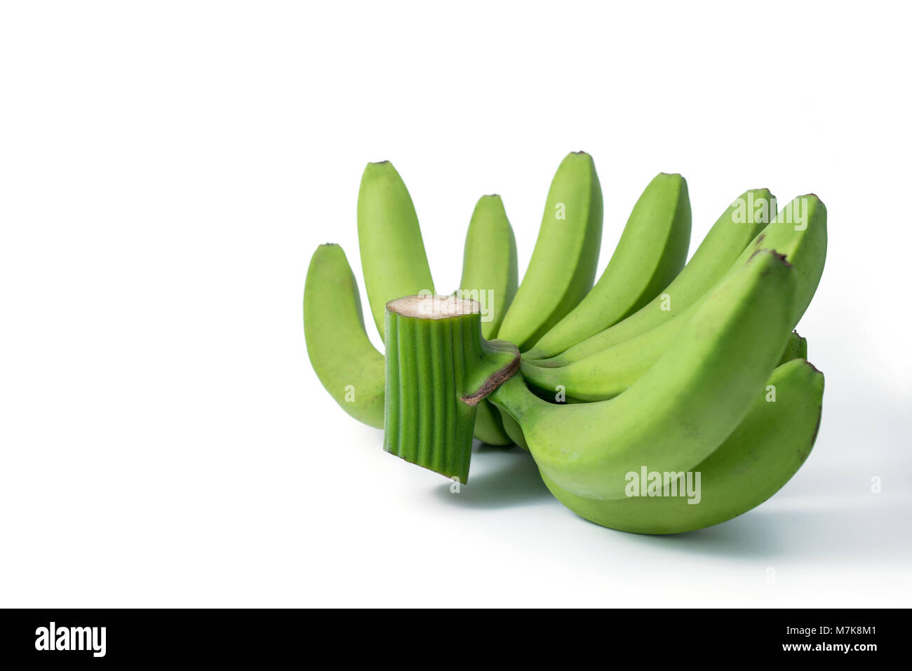 bunch of green bananas isolated on white background Stock Photo - Alamy