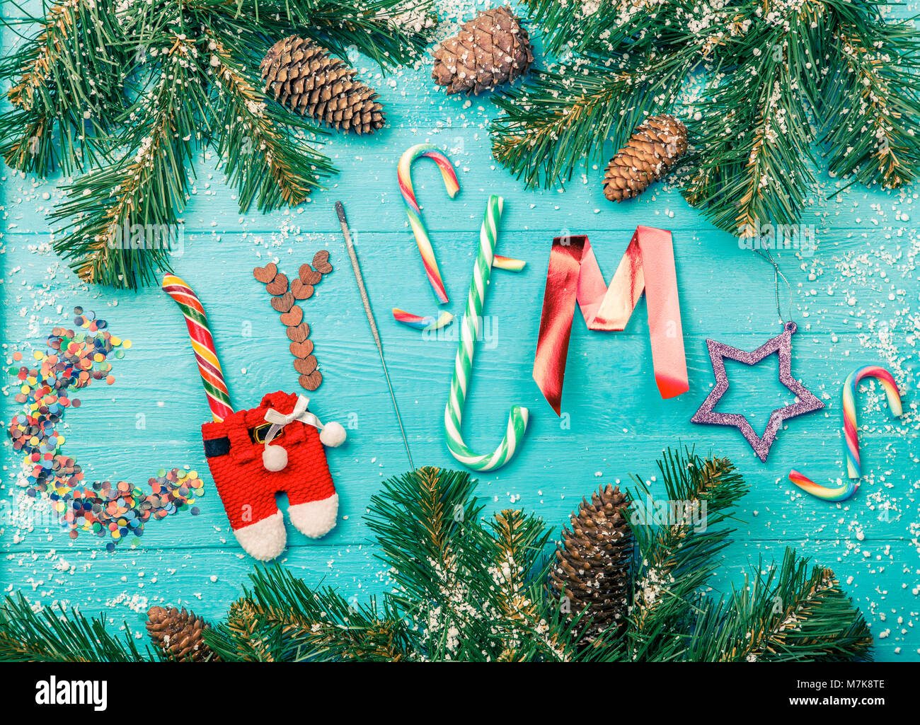 Toned photo of blue table with spruce branches, word Christmas Stock ...