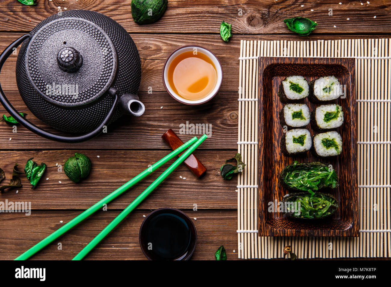 Wooden surface with rolls, tea Stock Photo - Alamy
