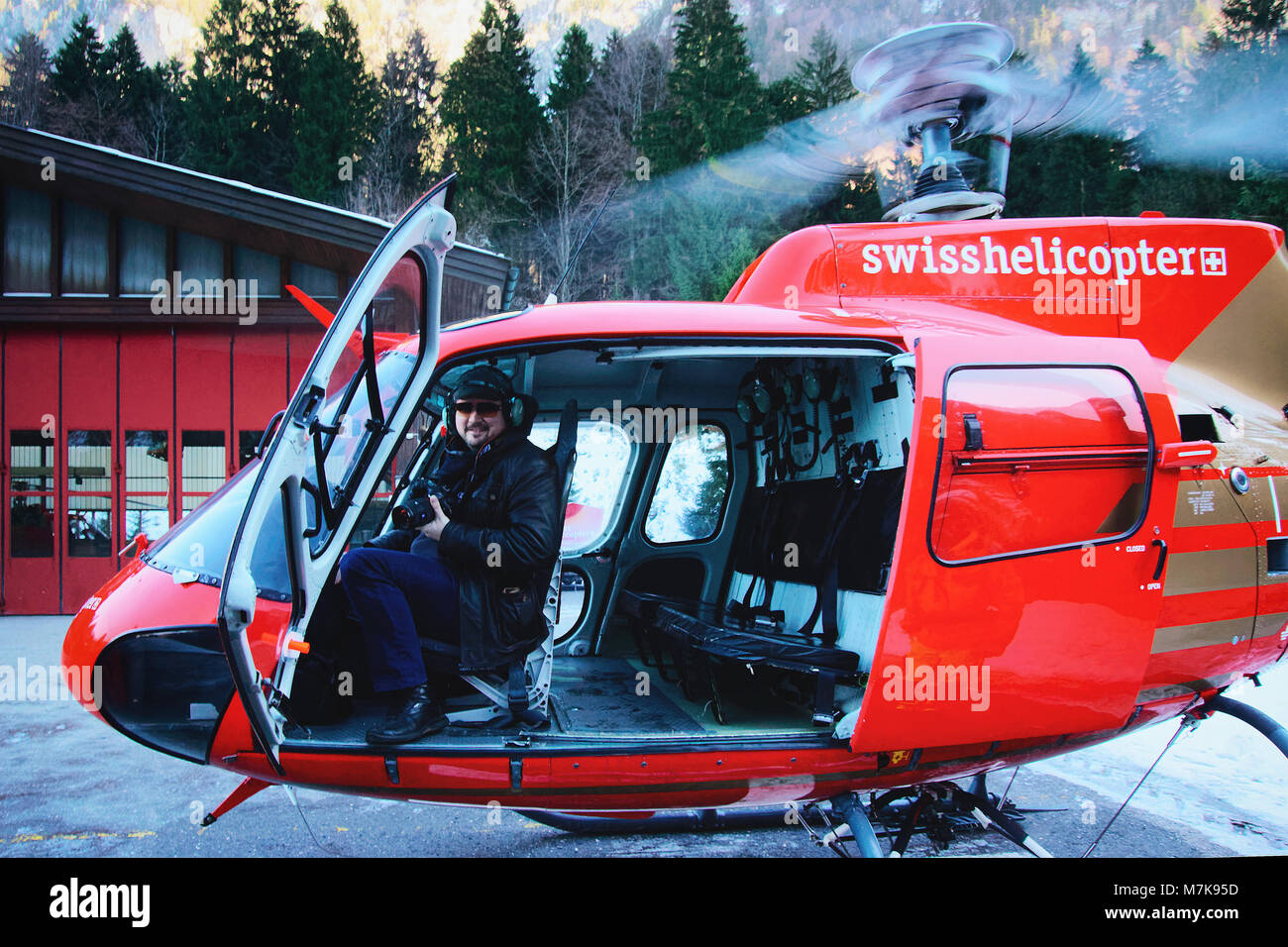 Gsteigwiler, Switzerland - December 31, 2013: Man in the cabin of a ...
