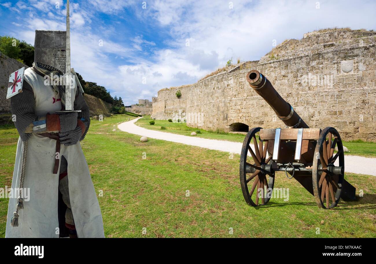 Medieval knight and artillery gun with fortifications of the Old Town ...