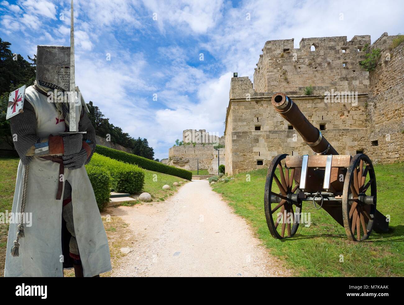 Medieval knight and artillery gun with fortifications of the Old Town ...
