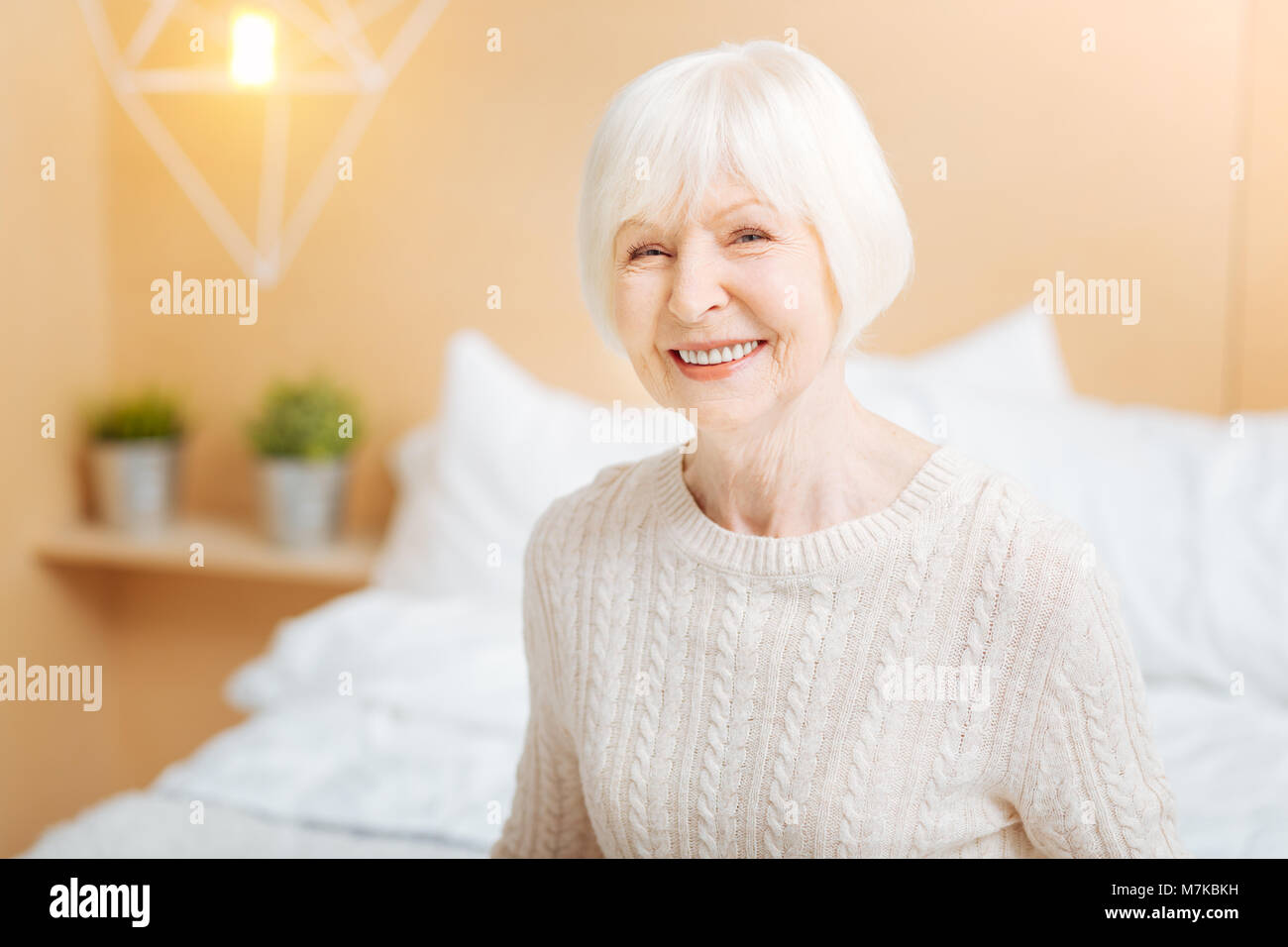 Adorable senior person feeling glad and smiling cheerfully Stock Photo ...