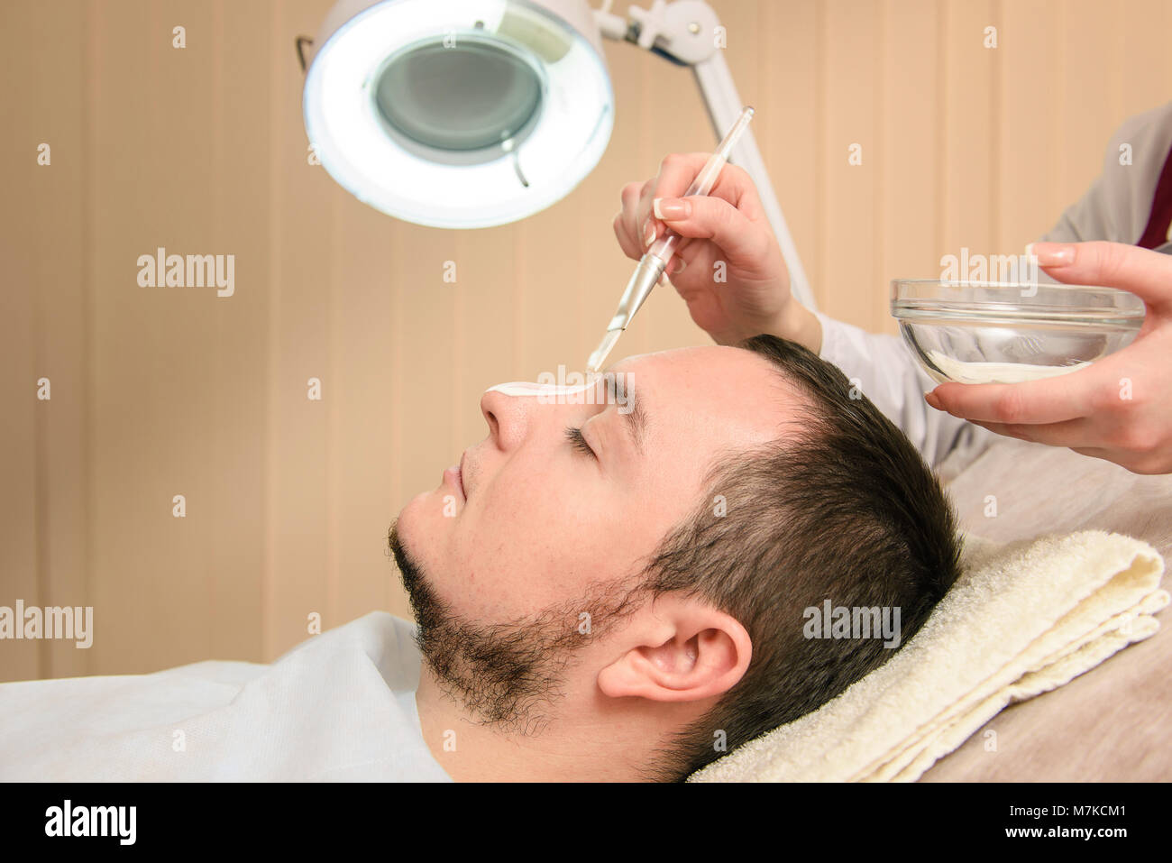 Male patient get facial treatment in hospital Stock Photo - Alamy