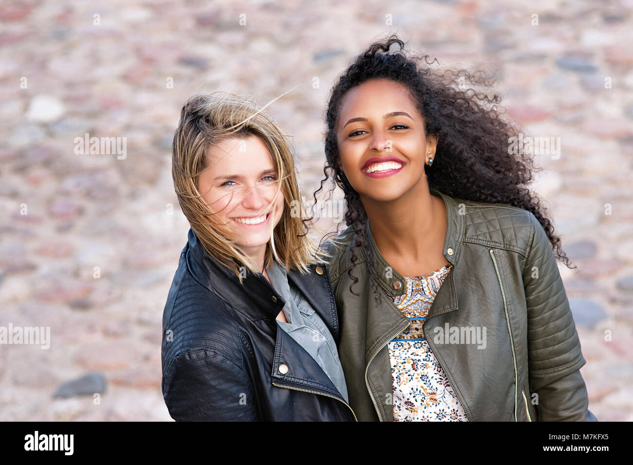 Happy caucasian and middle eastern female friends, as diversity ...