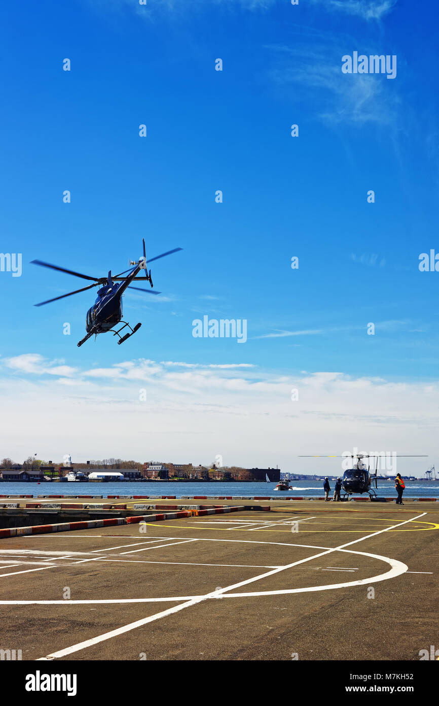 Black Helicopter taking off from helipad in Lower Manhattan in New York ...
