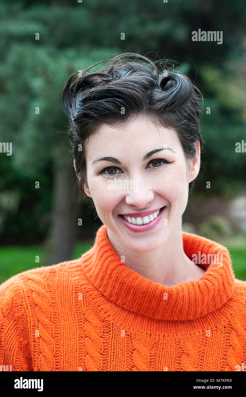 Woman wearing orange sweater hi-res stock photography and images - Alamy