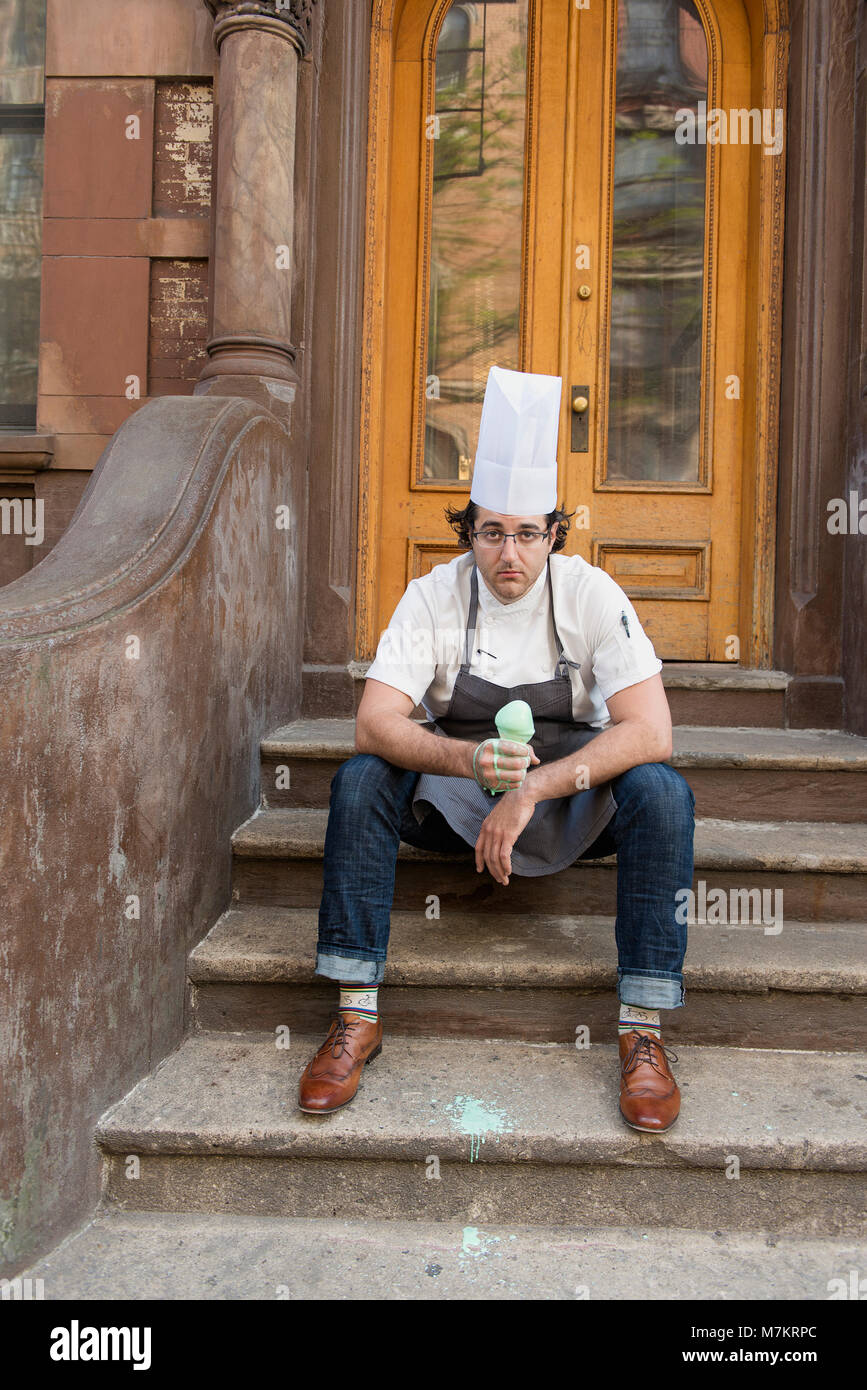 Sitting on stoop hi-res stock photography and images - Alamy