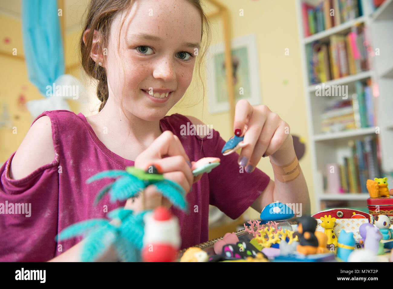 A young girl showing off her erasure collection Stock Photo - Alamy