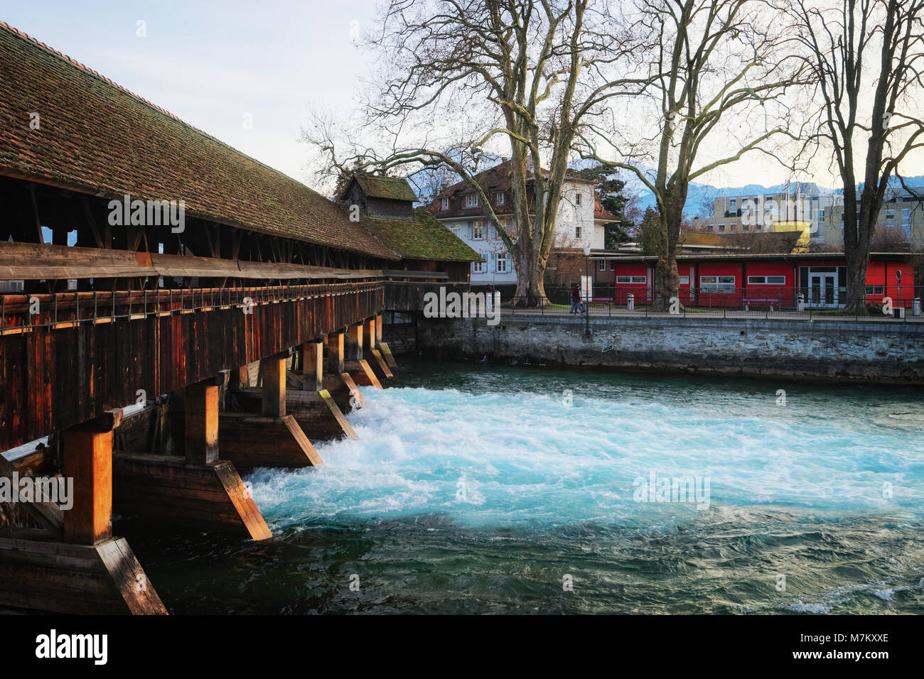 Thun, Switzerland - January 1, 2014: Old Wooden Sluice bridge and the ...