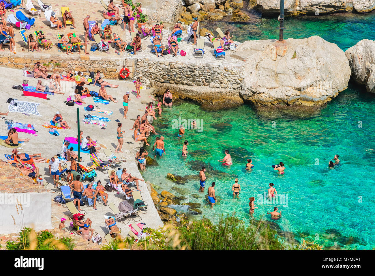 Scopello, Italy - September 17, 2017: People swimming at beach of ...