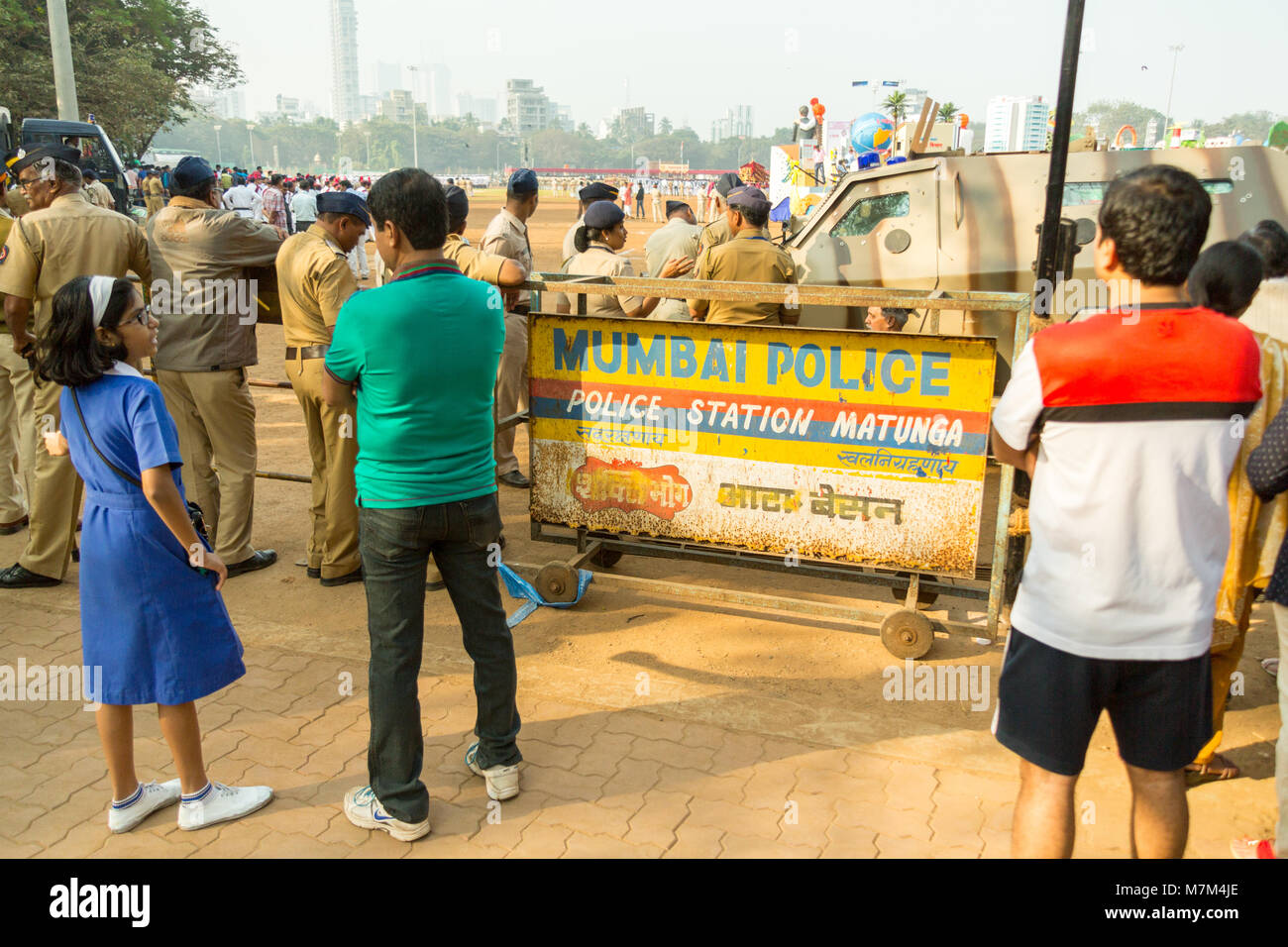 People Wait Behind a Barrier Stock Photo - Alamy