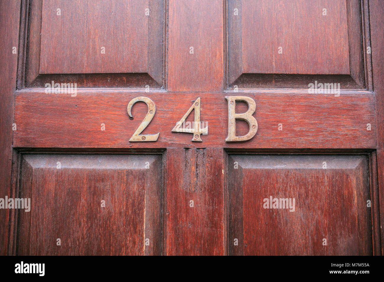Address number in a wooden door Stock Photo - Alamy