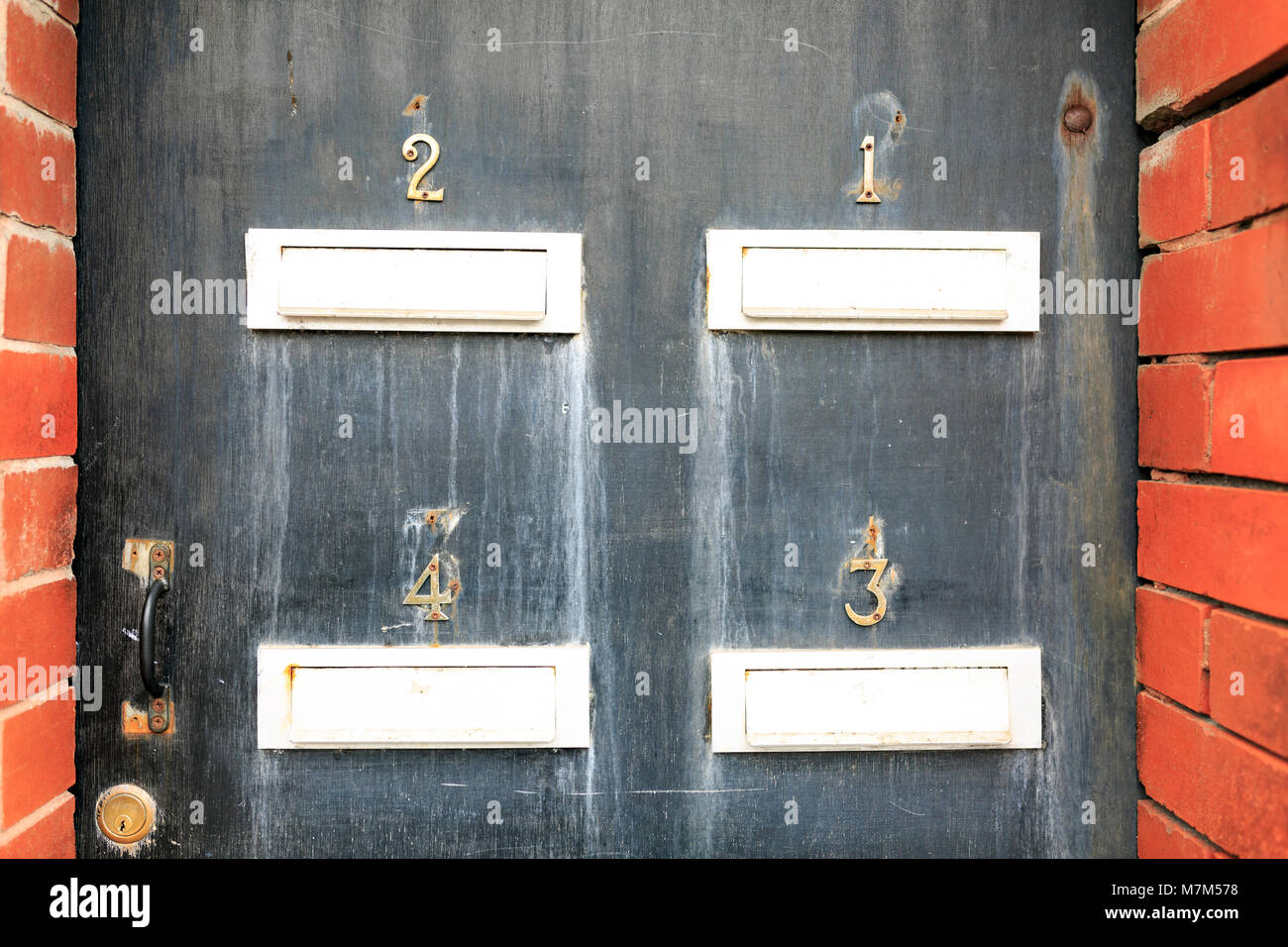 Address number in a wooden door Stock Photo - Alamy