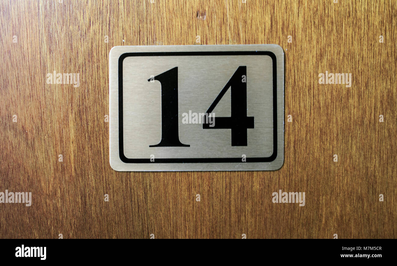 Address number in a wooden door Stock Photo - Alamy