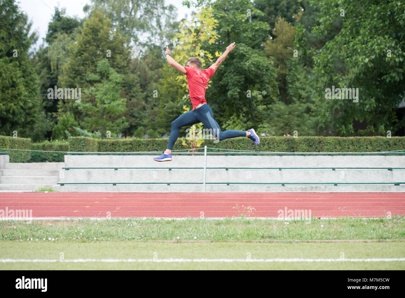 Young Athlete Man Running on Track In Park Run Athletics Race Stock ...