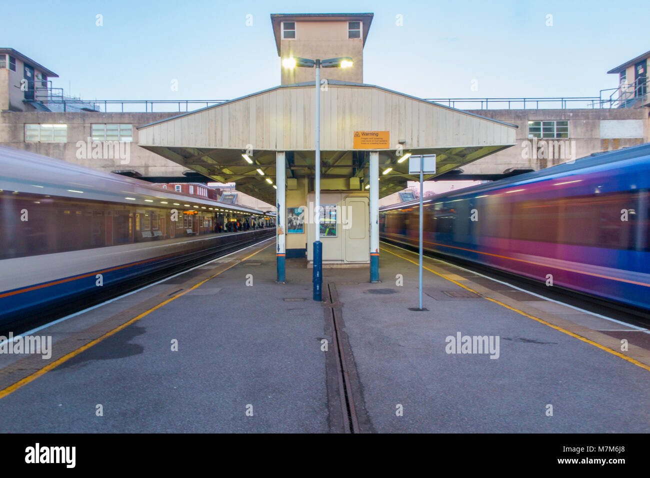 Woking station in Surrey with trains storming past the platforms on ...