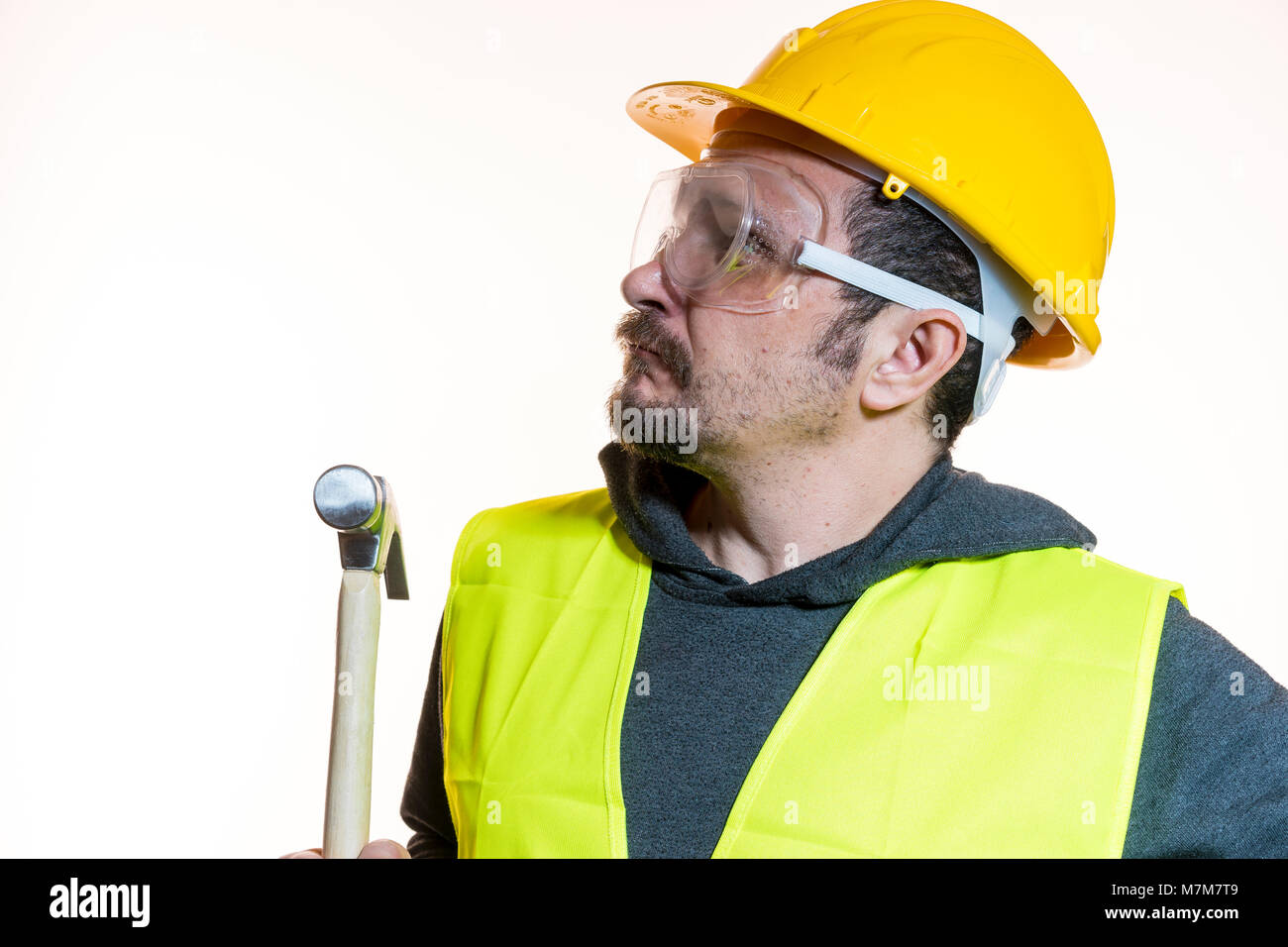 Do it yourself, man dressed in yellow builder helmet with protective ...
