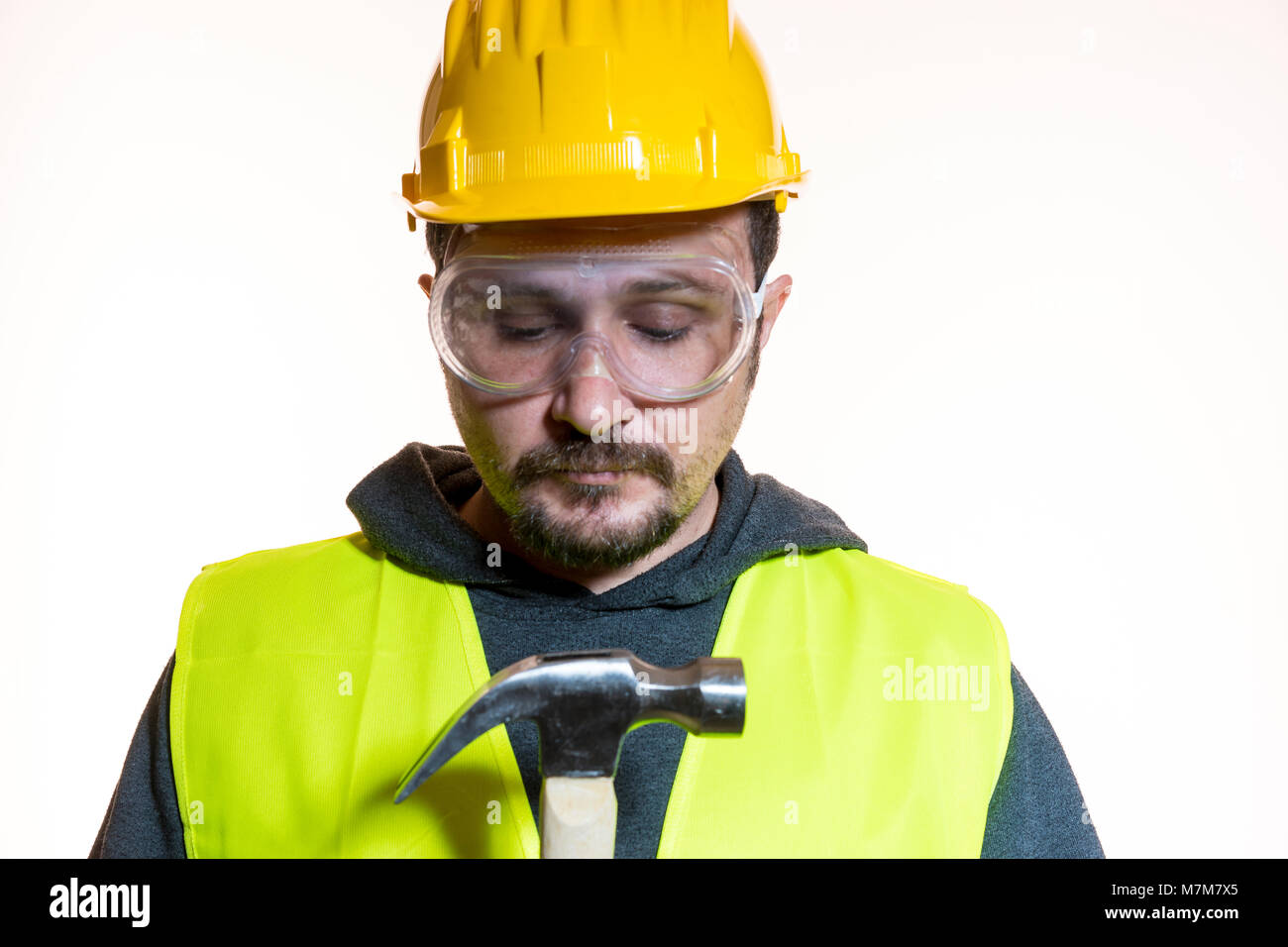 Do it yourself, man dressed in yellow builder helmet with protective ...