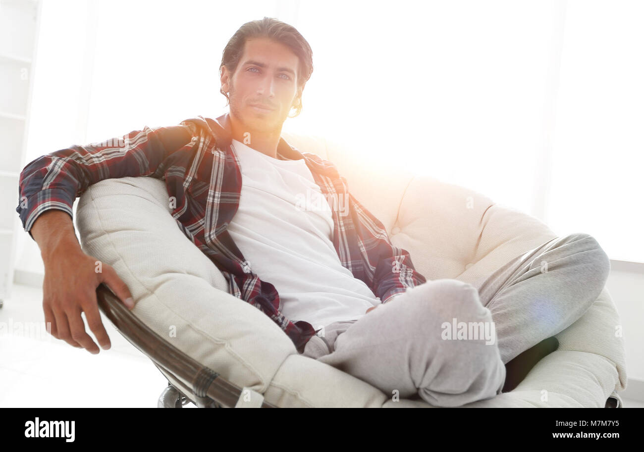 successful guy resting in modern living room Stock Photo - Alamy