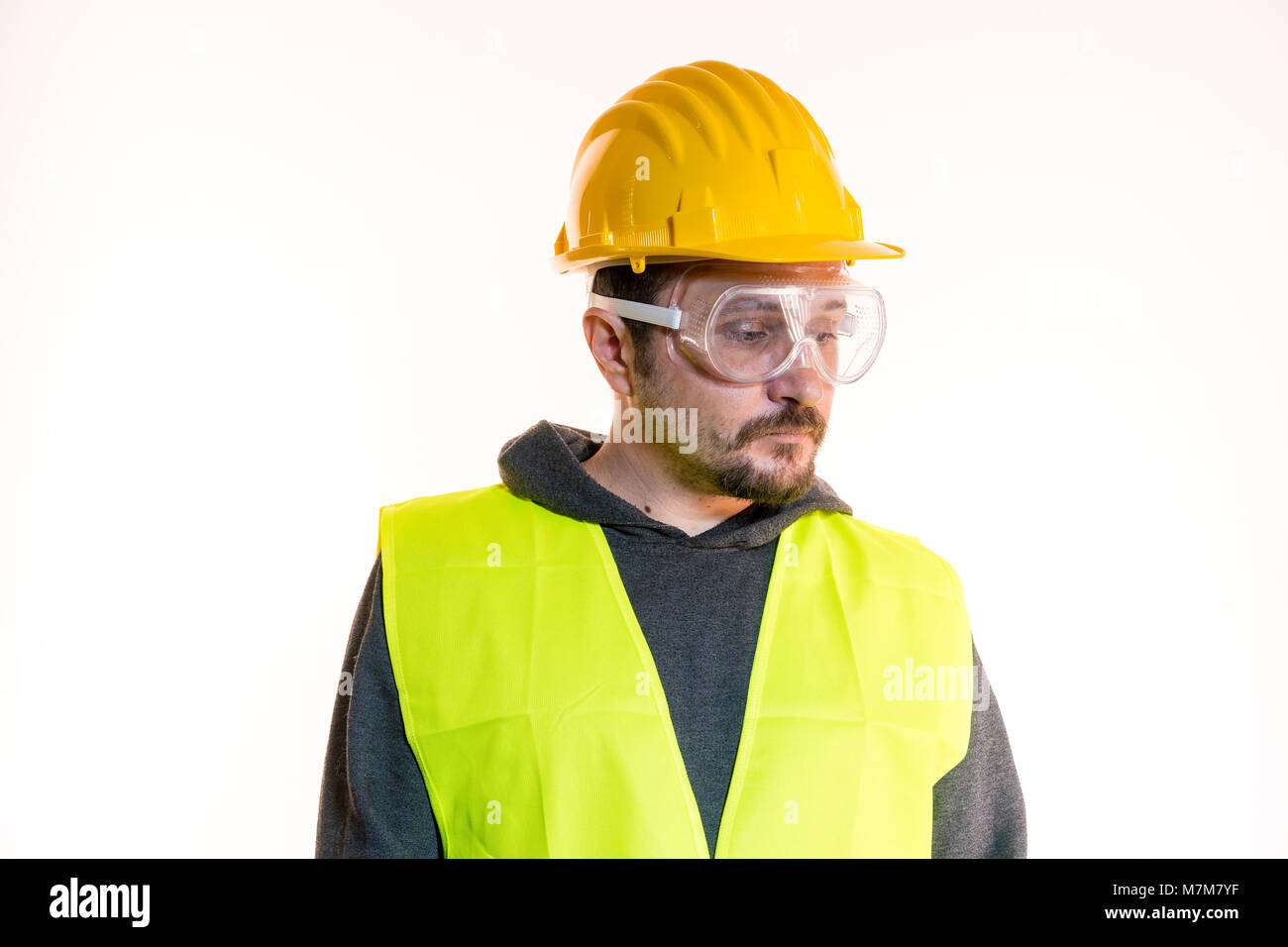 Do it yourself, man dressed in yellow builder helmet with protective ...