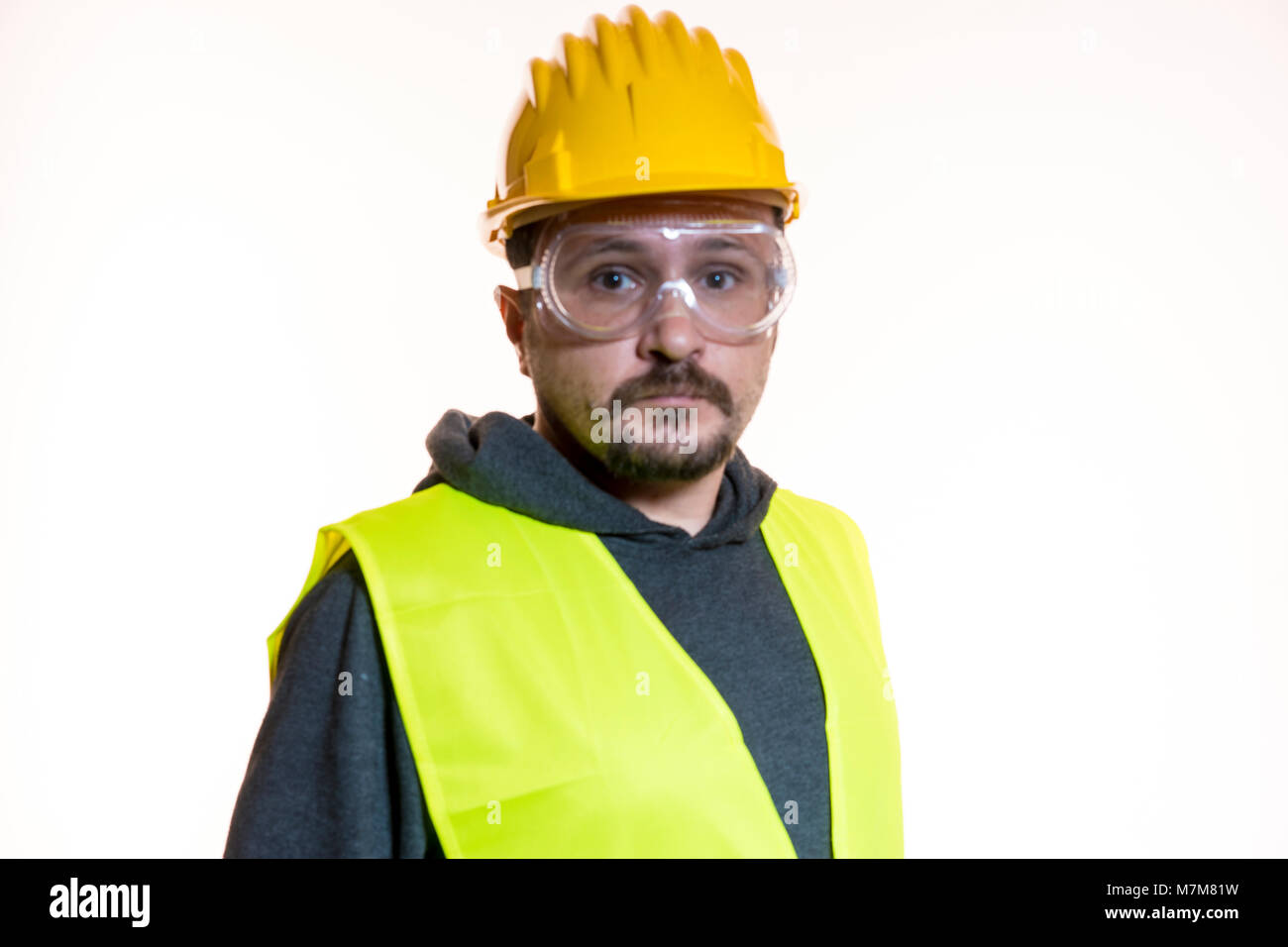 Do it yourself, man dressed in yellow builder helmet with protective ...