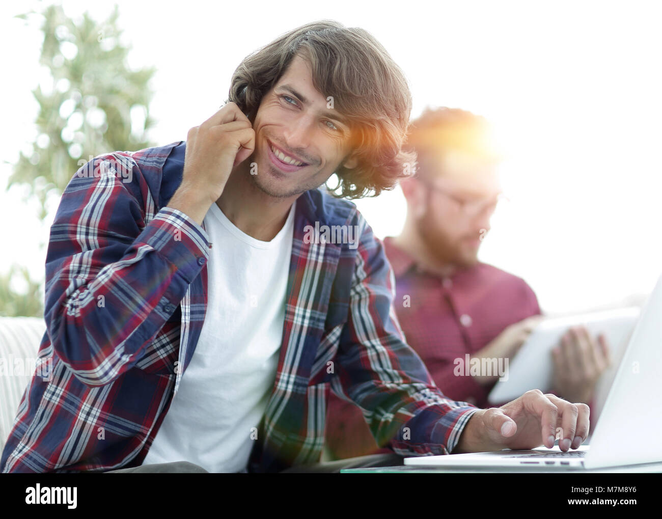 Guy friend sitting desk hi-res stock photography and images - Alamy