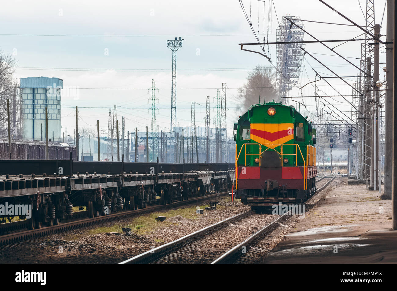 Green diesel cargo locomotive. Freight train in action Stock Photo - Alamy