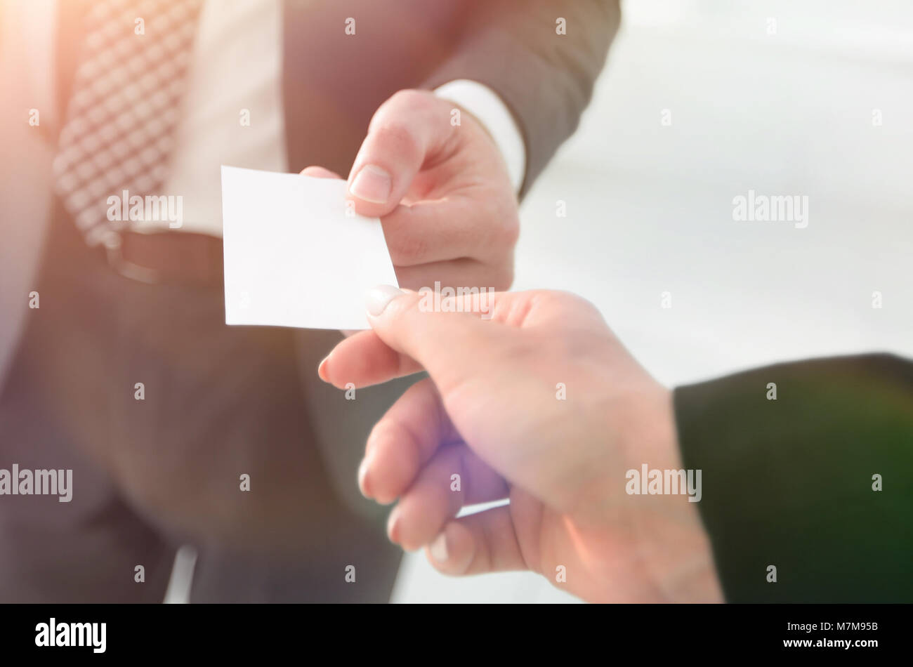 Exchange business card for first time meet Stock Photo - Alamy
