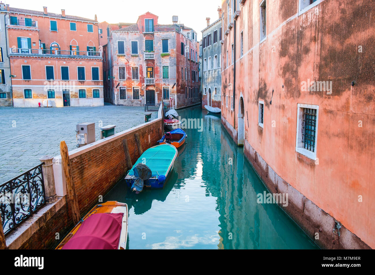 Typical Venice narrow water canal and old traditional colorful ...