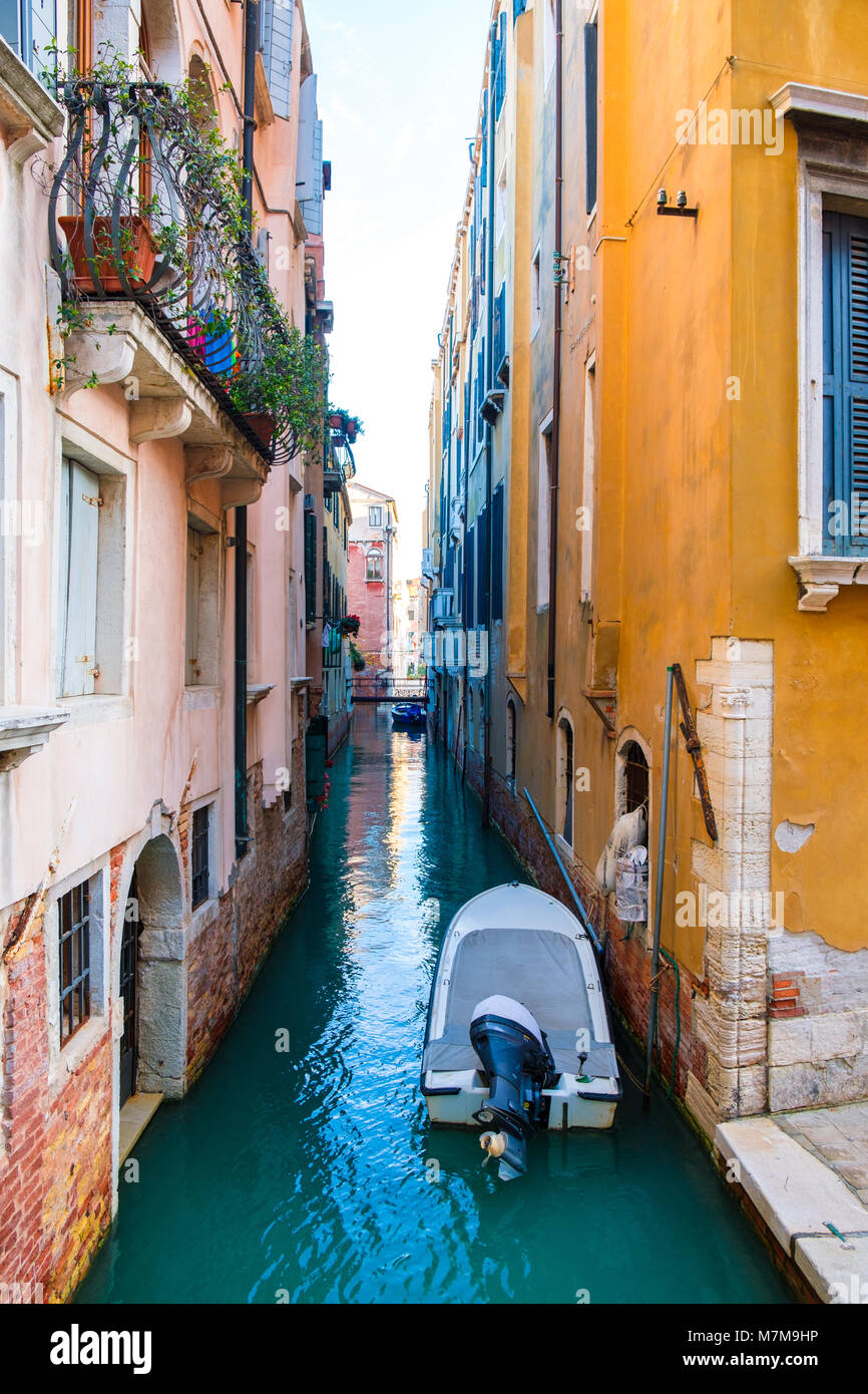 Typical Venice narrow water canal and old traditional colorful ...
