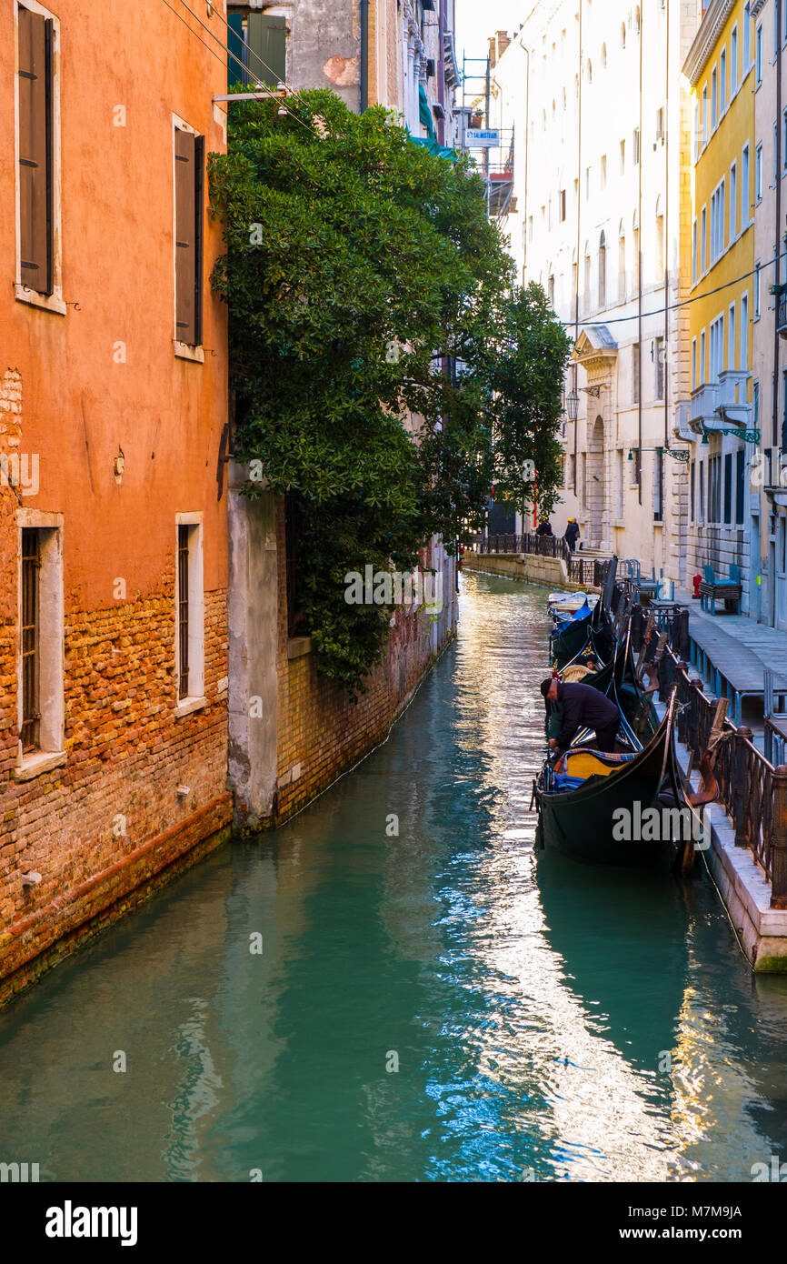 Typical Venice narrow water canal and old traditional colorful ...