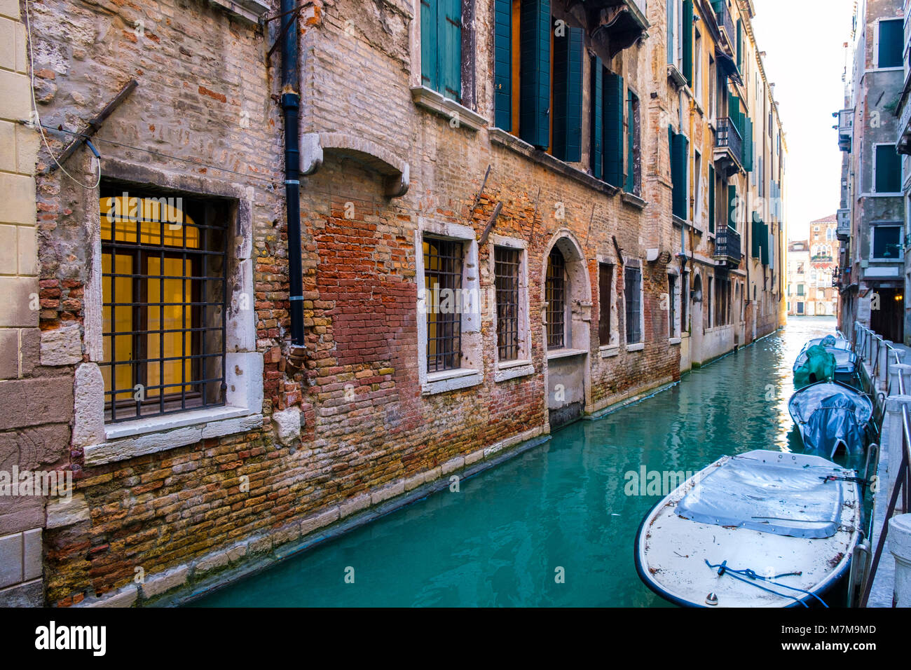 Typical Venice narrow water canal and old traditional colorful ...