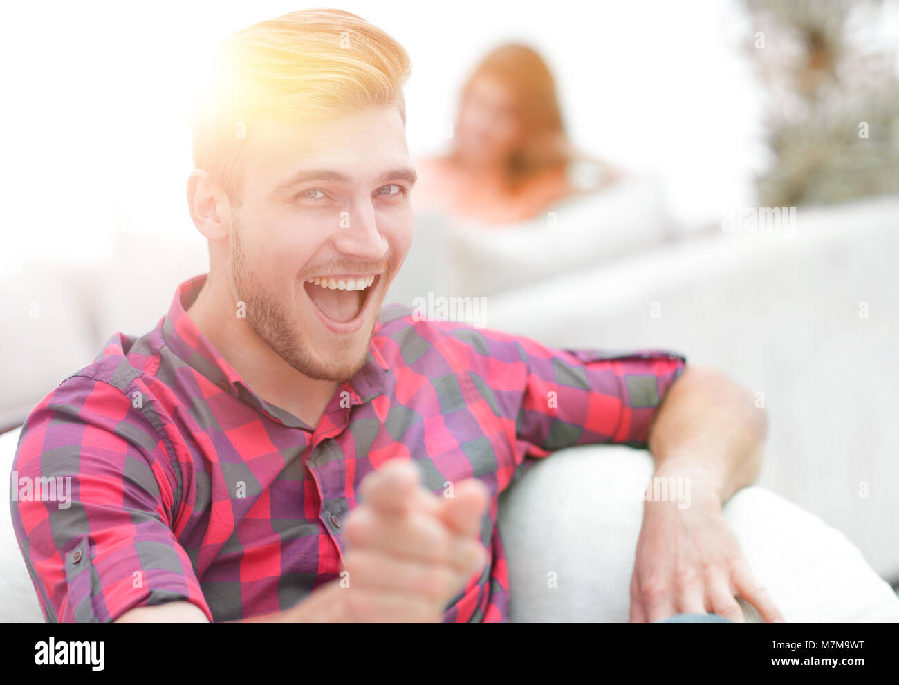 closeup of happy young man showing forward Stock Photo - Alamy