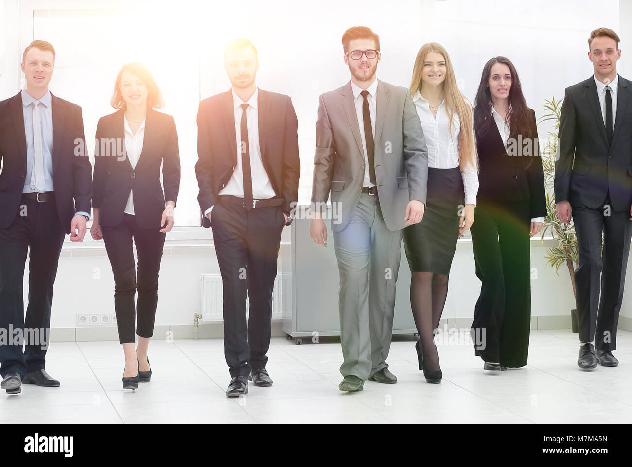 bottom view. business team walking forward Stock Photo - Alamy