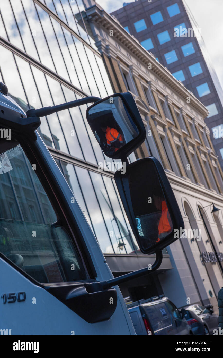 the wing mirrors on a large truck or lorry in central london turning in ...