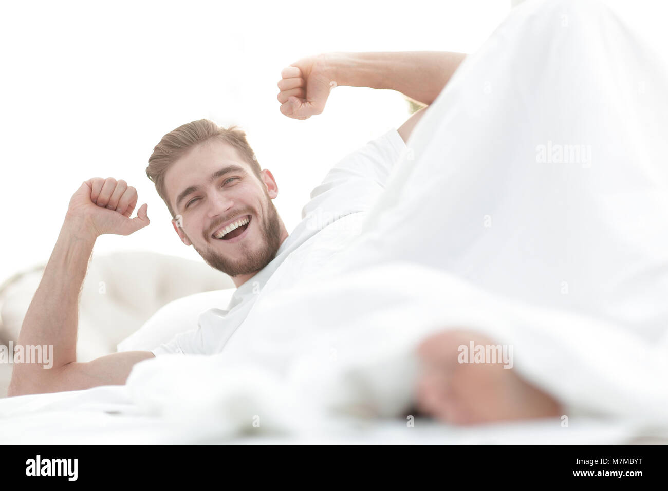 closeup.happy man resting in the bedroom Stock Photo - Alamy