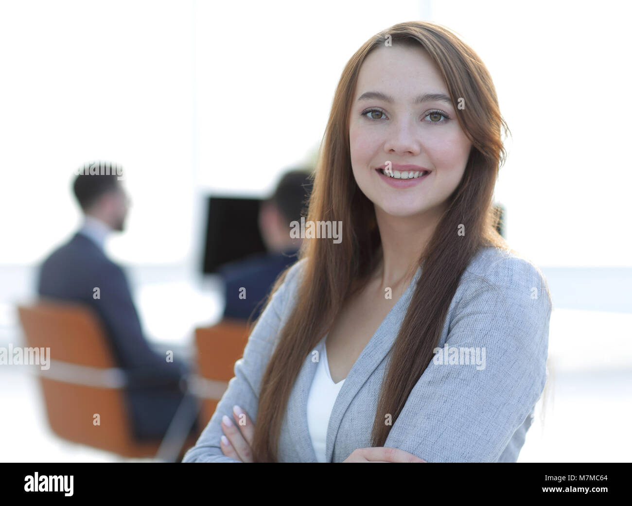 business woman on blurred background office Stock Photo - Alamy