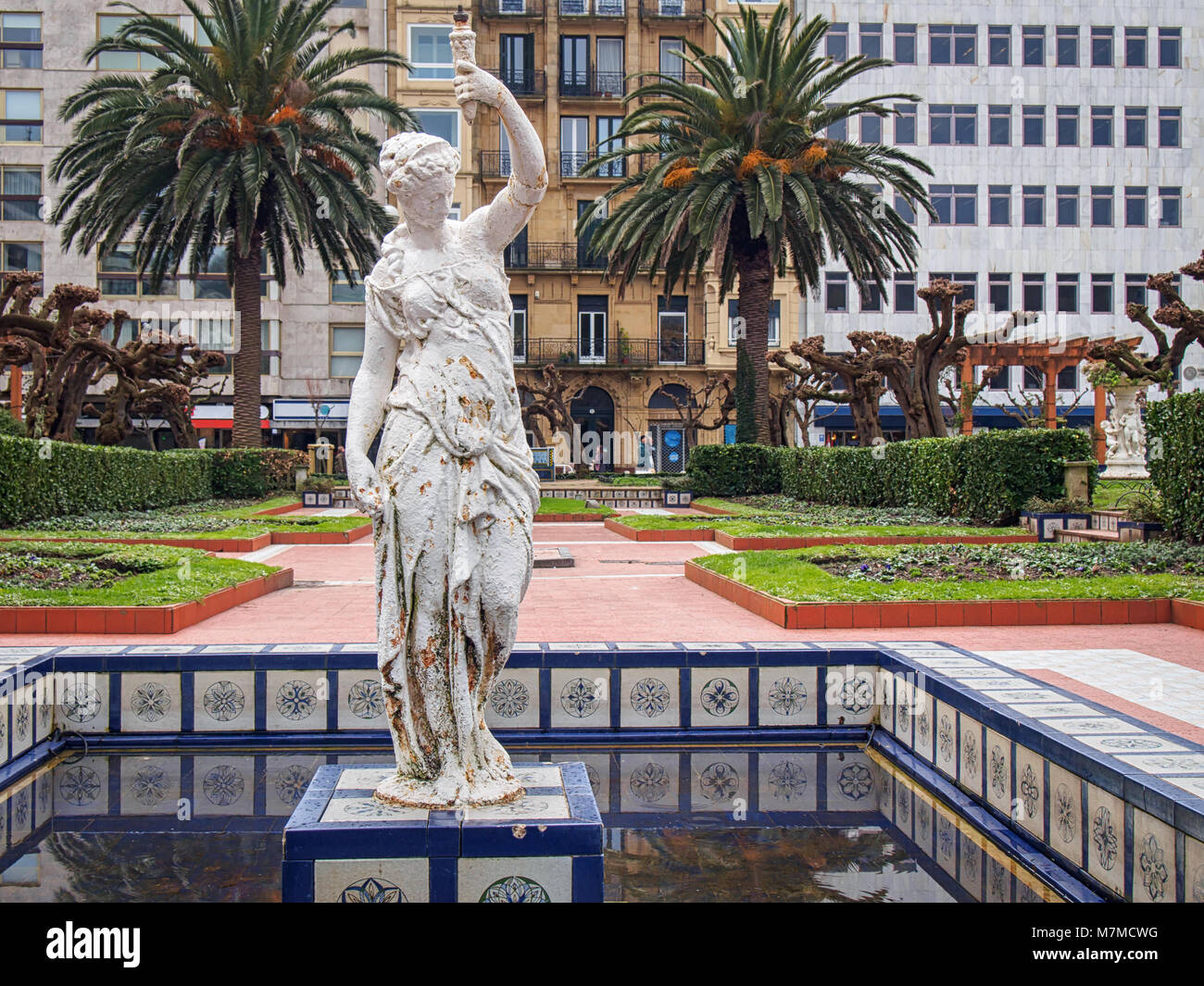 Girl with amphora fountain statue in San Sebastian, Basque Country ...