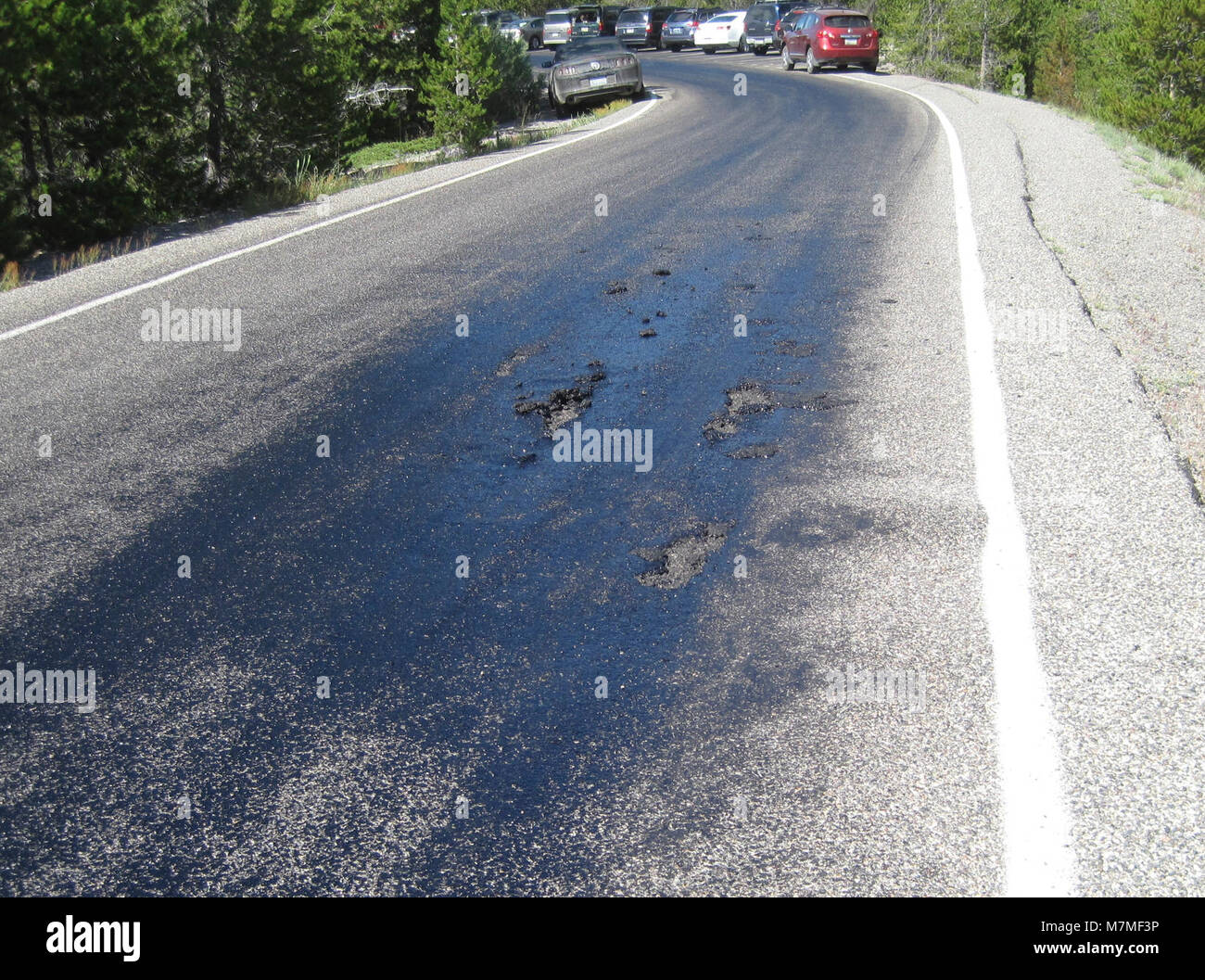 Damaged tarmac road Stock Photo - Alamy