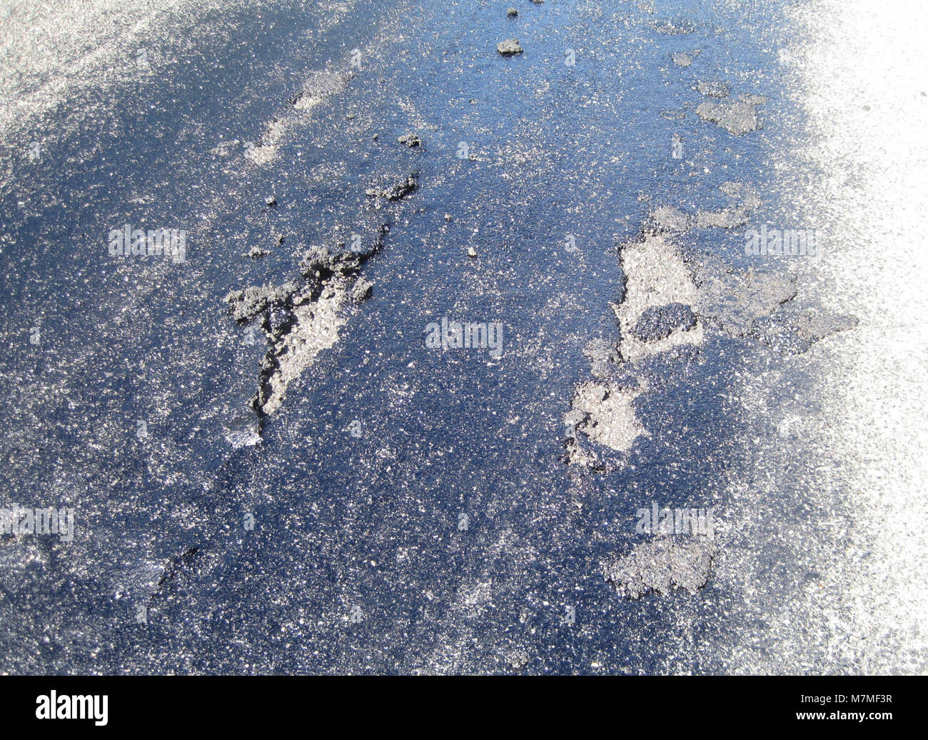 Damaged tarmac road Stock Photo - Alamy