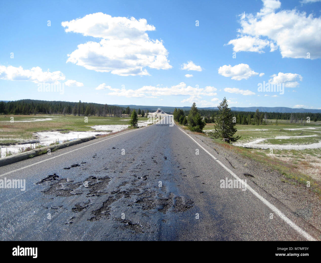Damaged tarmac road Stock Photo - Alamy